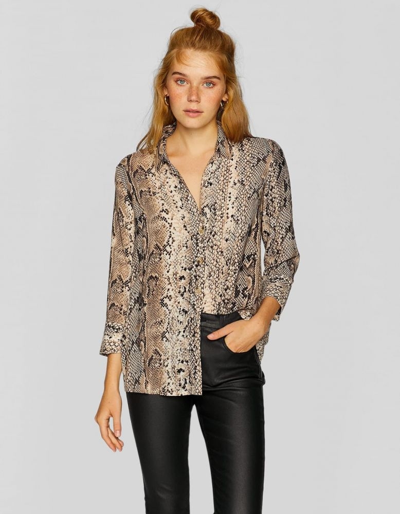 Tendance: 7 façons de porter l'imprimé python cet hiver - ELLE.be